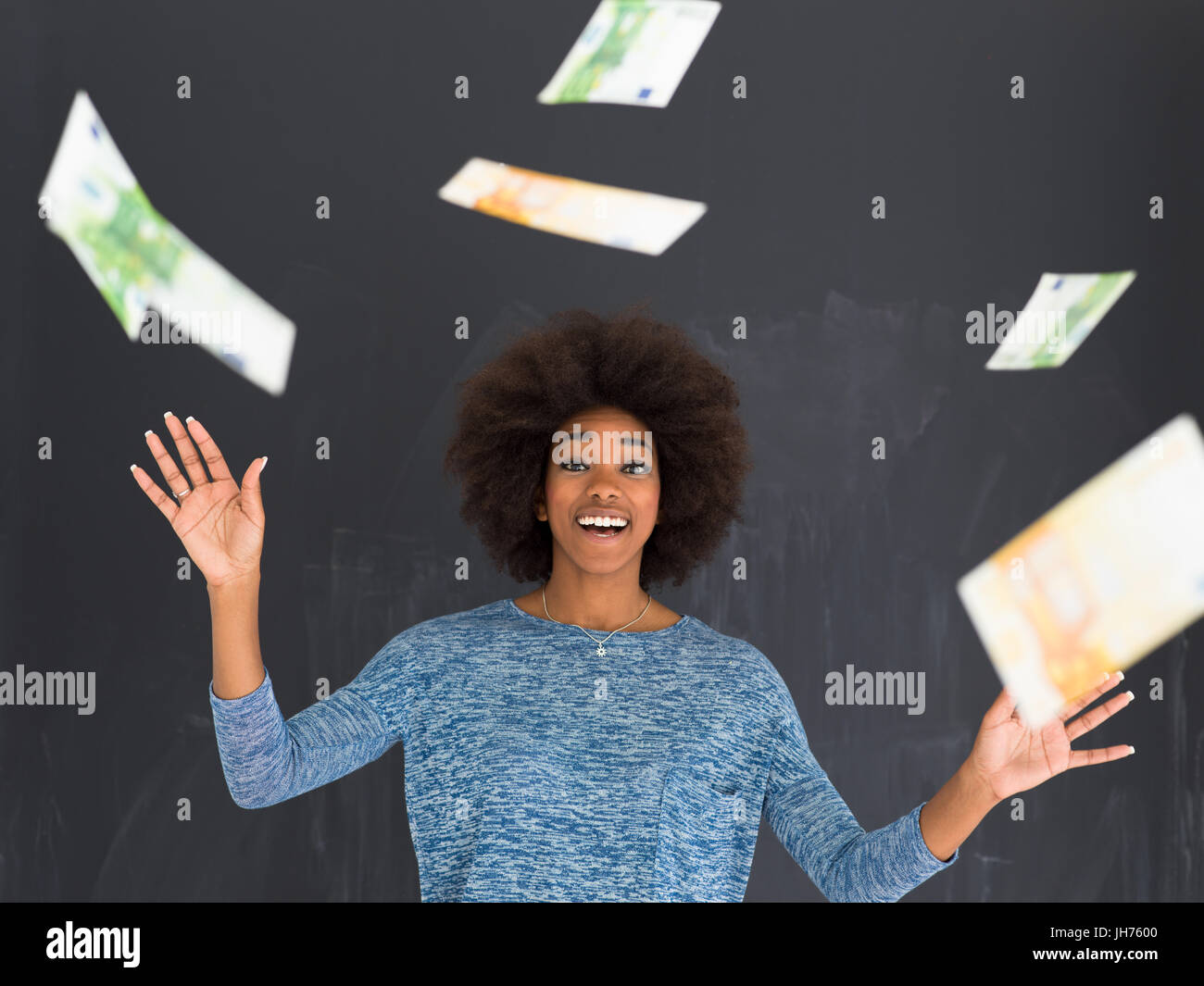 beautiful smiling afro american woman throwing money isolated on a gray ...