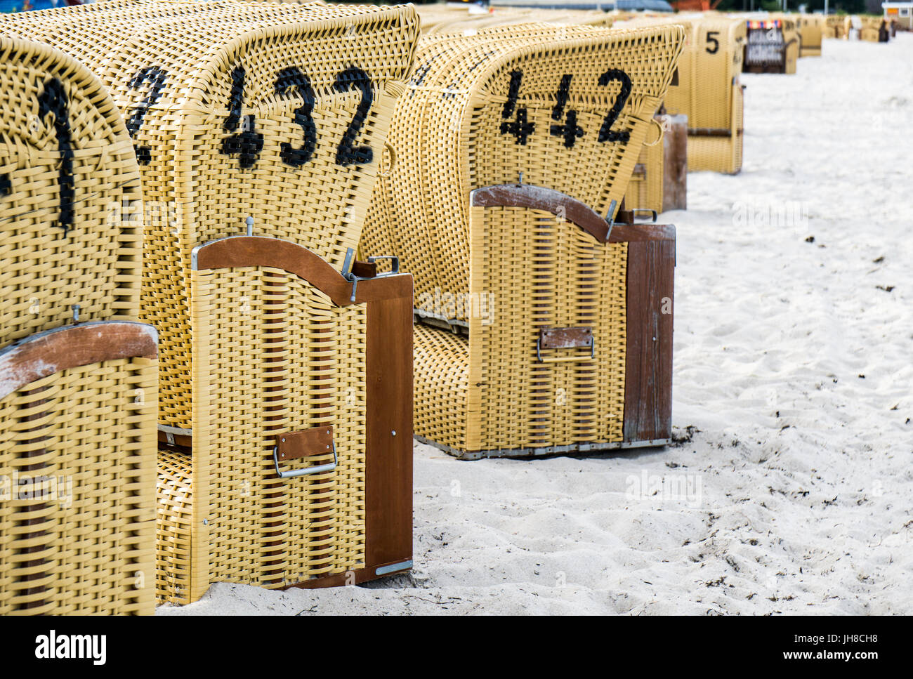 European Beach wicker chairs are placed decoratively on the beach for ...