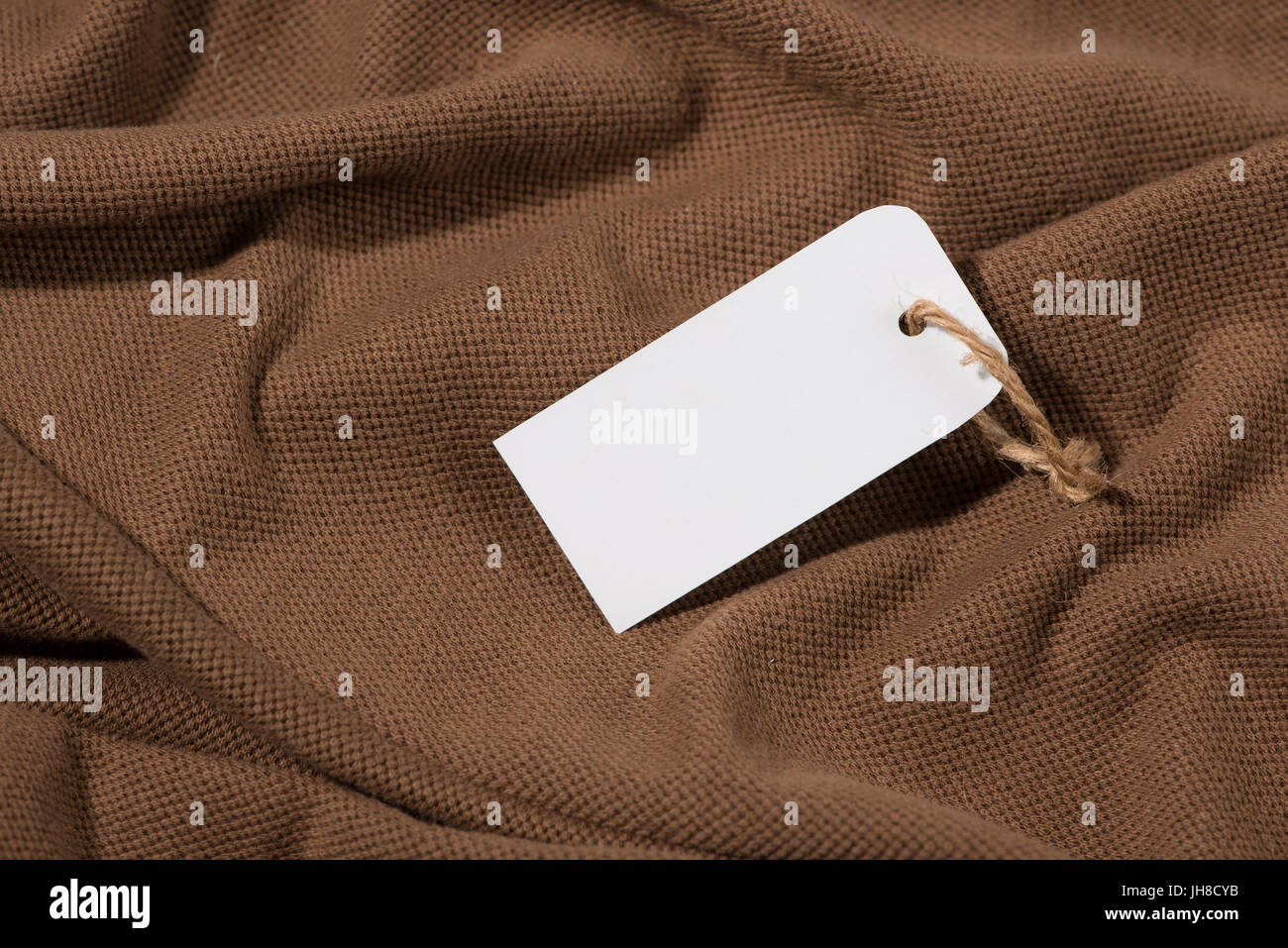 Shirt price tag. Rectangular tag is attached to a sweater Stock Photo ...