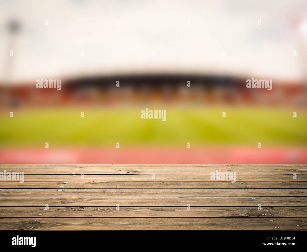 wooden counter with soccer field background Stock Photo - Alamy