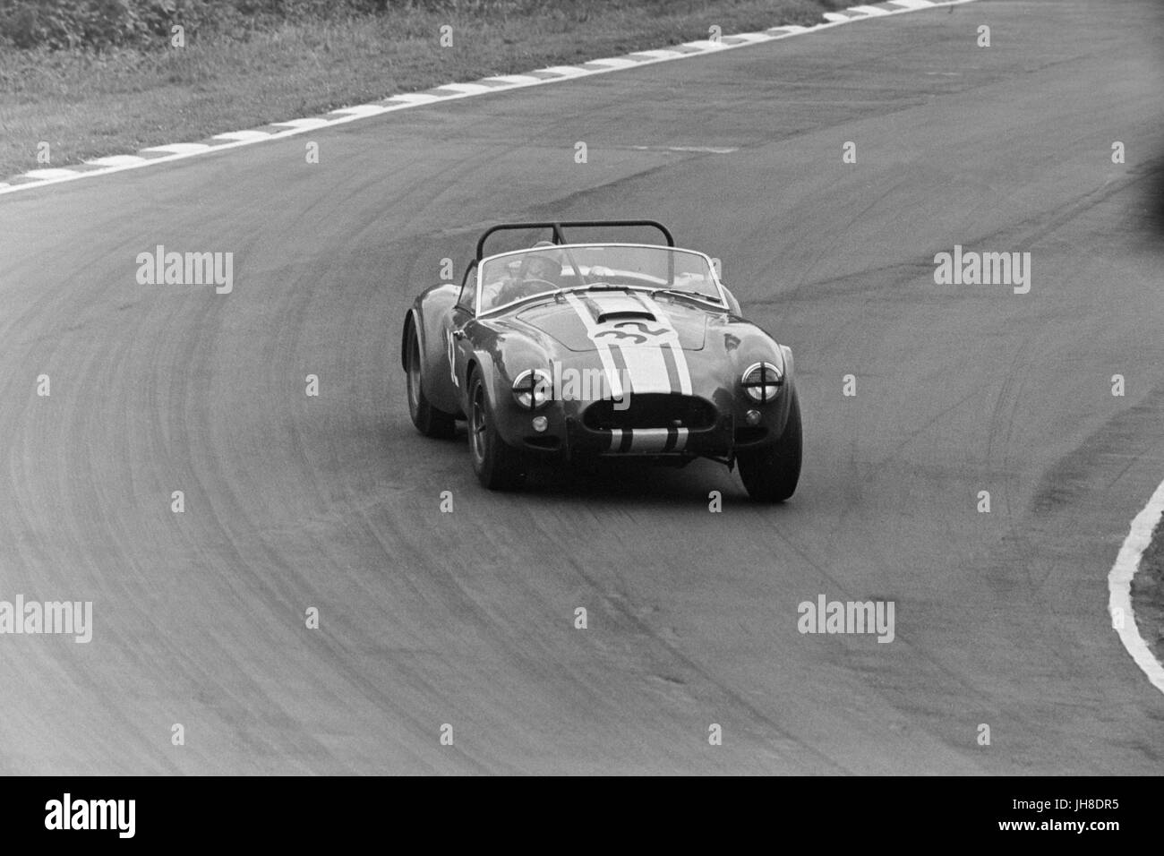 An AC Cobra driven by Jack Sears at the British Motor racing Circuit at ...