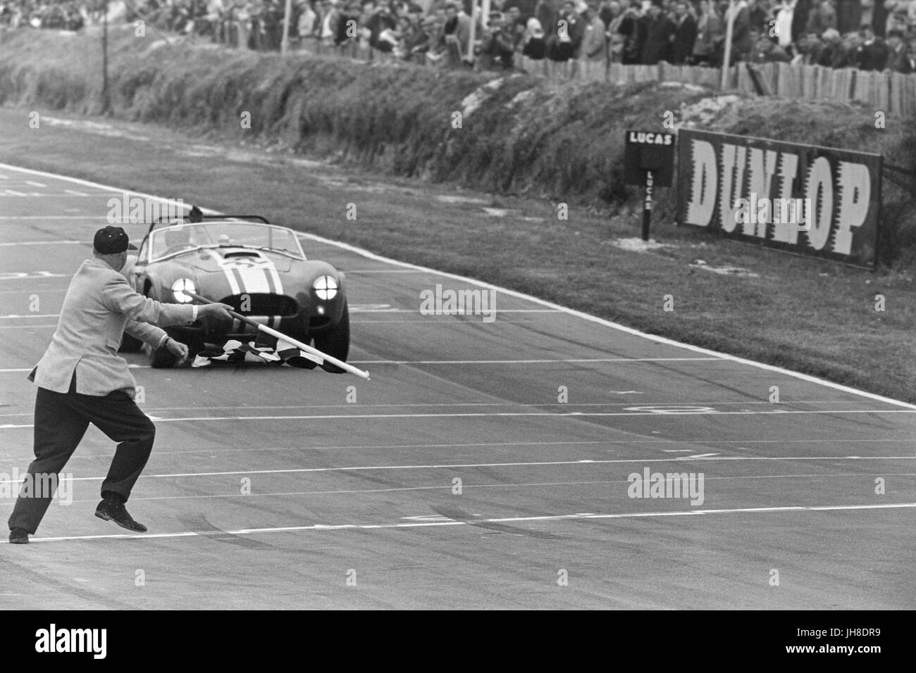 An AC Cobra driven by Jack Sears at the British Motor racing Circuit at ...