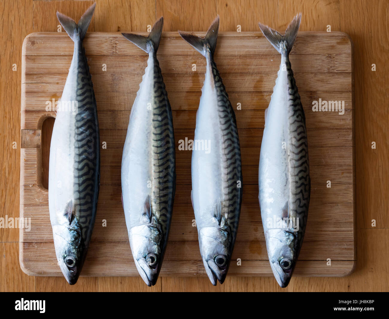 Mackerel fish on kitchen board top view Stock Photo - Alamy