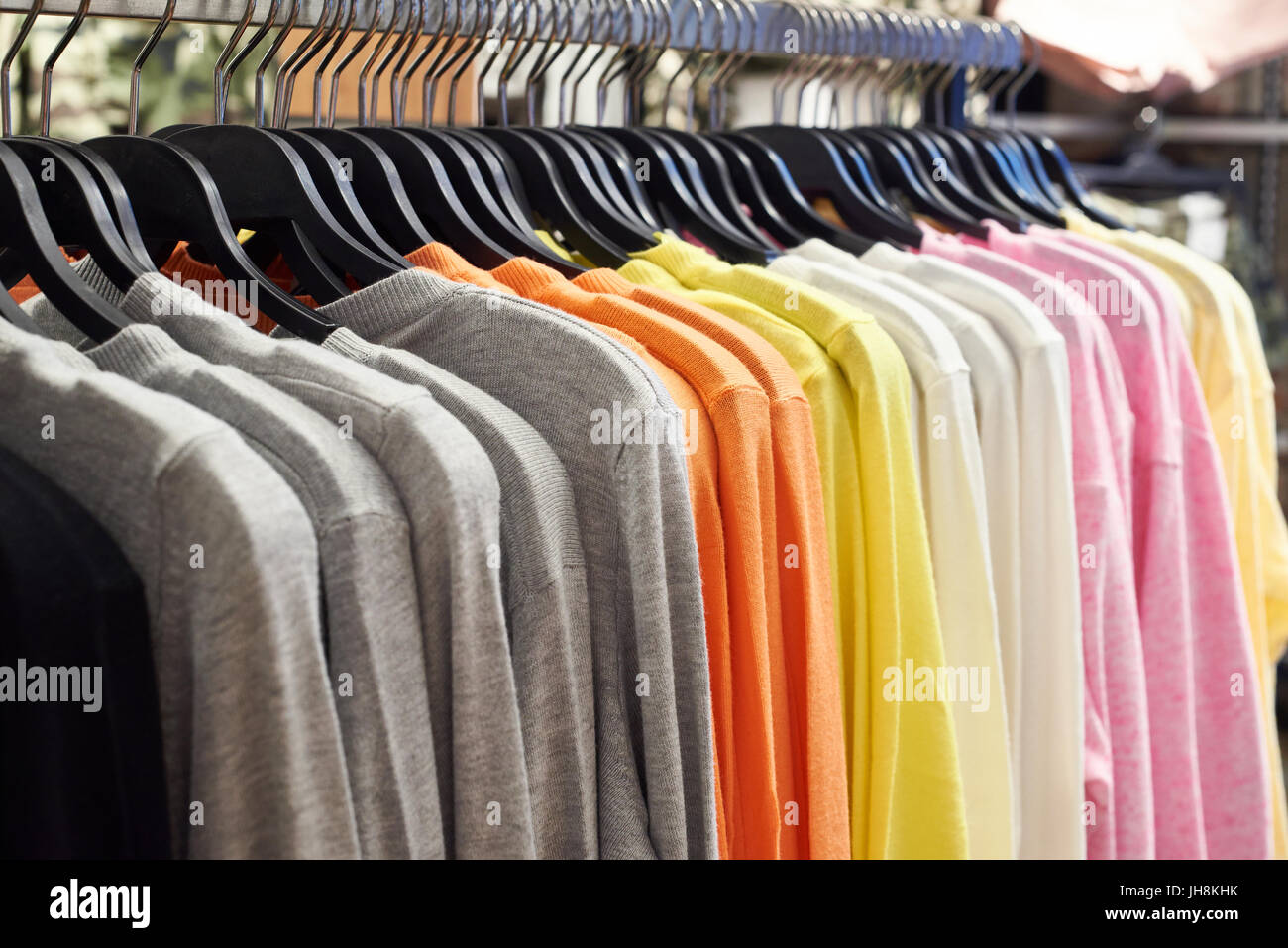 Clothing on hangers in the store Stock Photo - Alamy