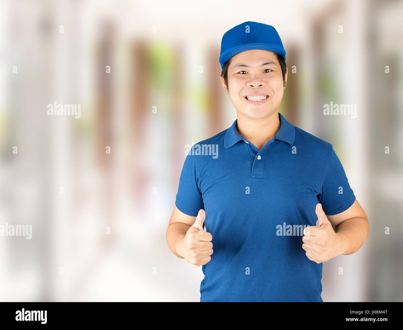 delivery man thumbs up Stock Photo - Alamy
