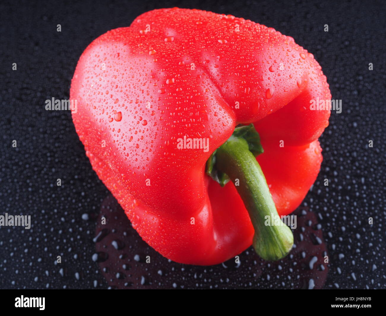 Pepper on a dark background Stock Photo - Alamy
