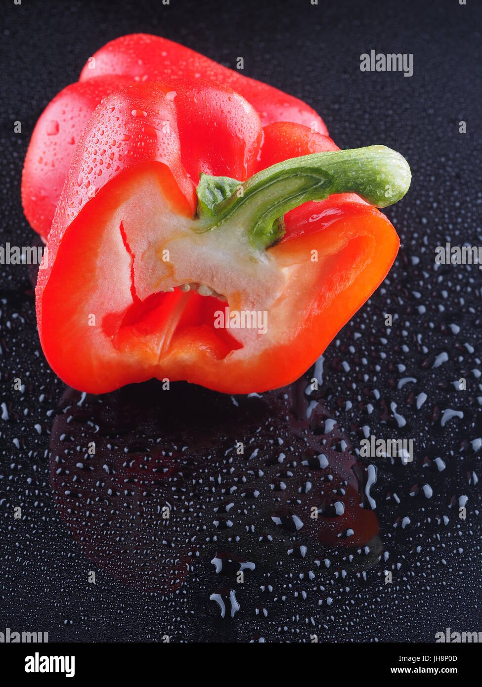 Pepper on a dark background Stock Photo - Alamy