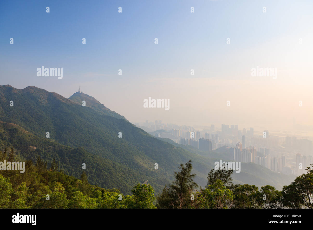 Hong kong tall buildings in haze Stock Photo - Alamy