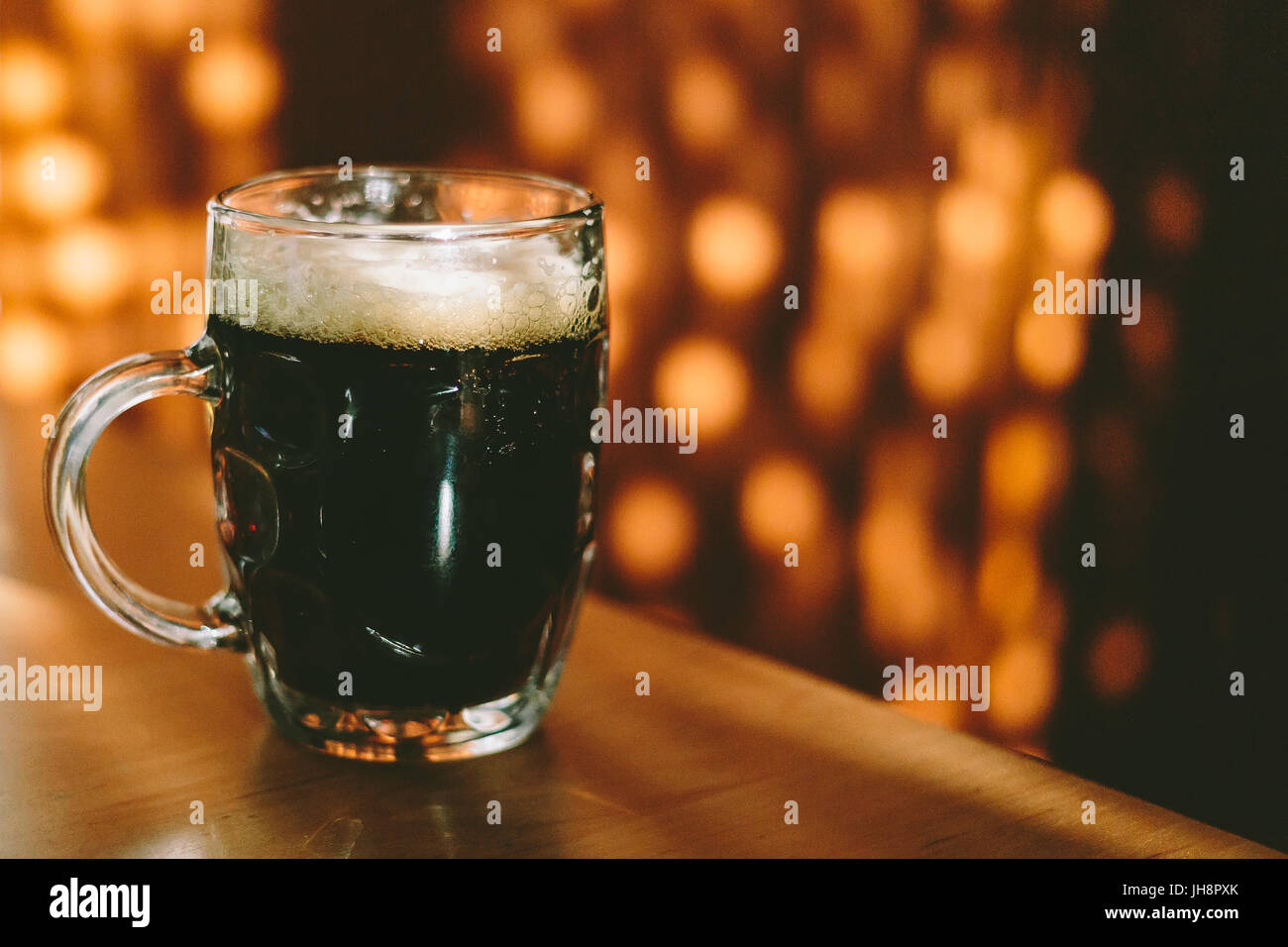 Dark beer in a pitcher Stock Photo - Alamy