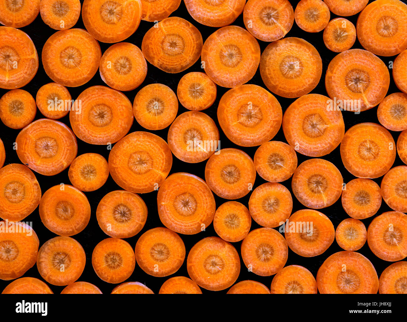 Carrot rings pattern. Top view Stock Photo - Alamy