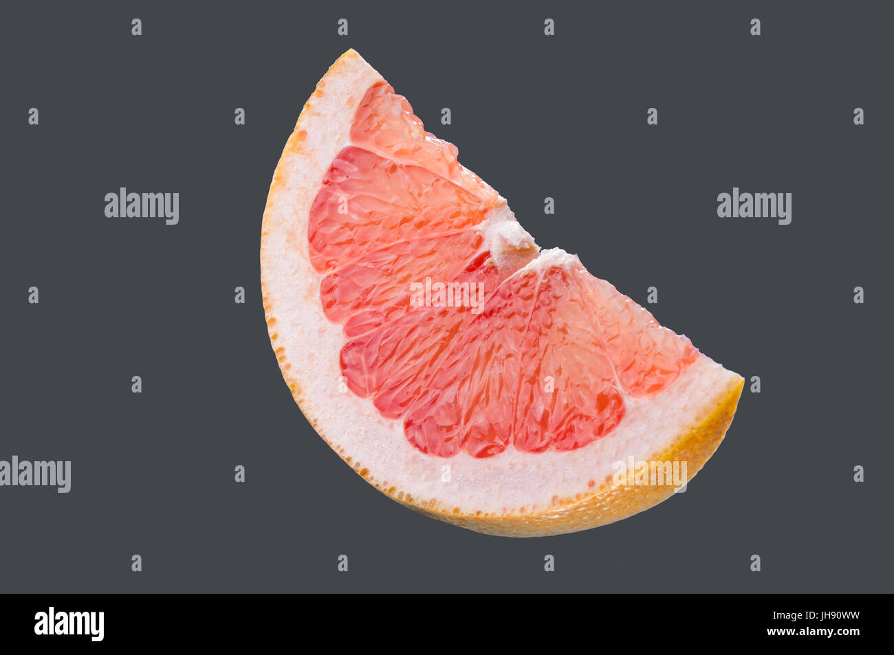 Parts of grapefruit on dark background. Studio shot retouched Stock ...