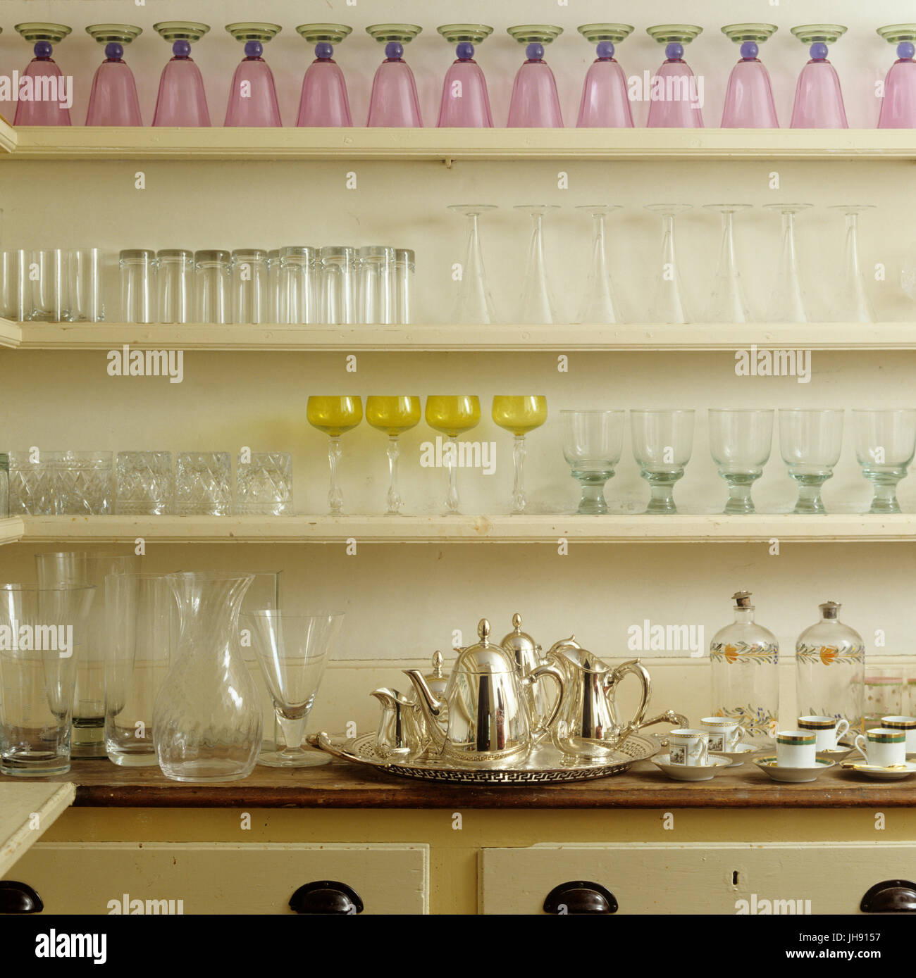 Vintage glassware on shelving Stock Photo - Alamy