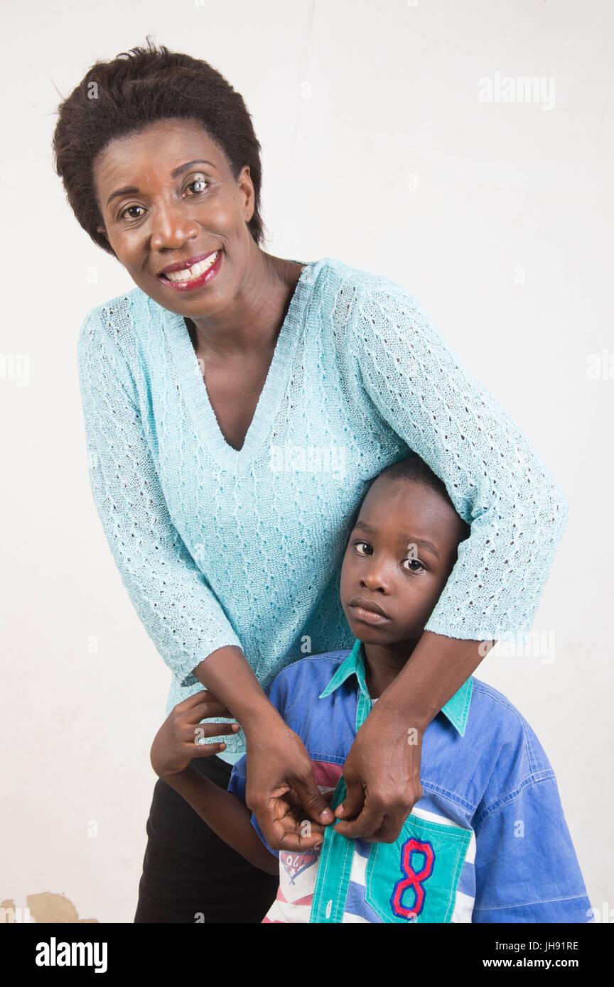 smiling mother cares for her son Stock Photo - Alamy