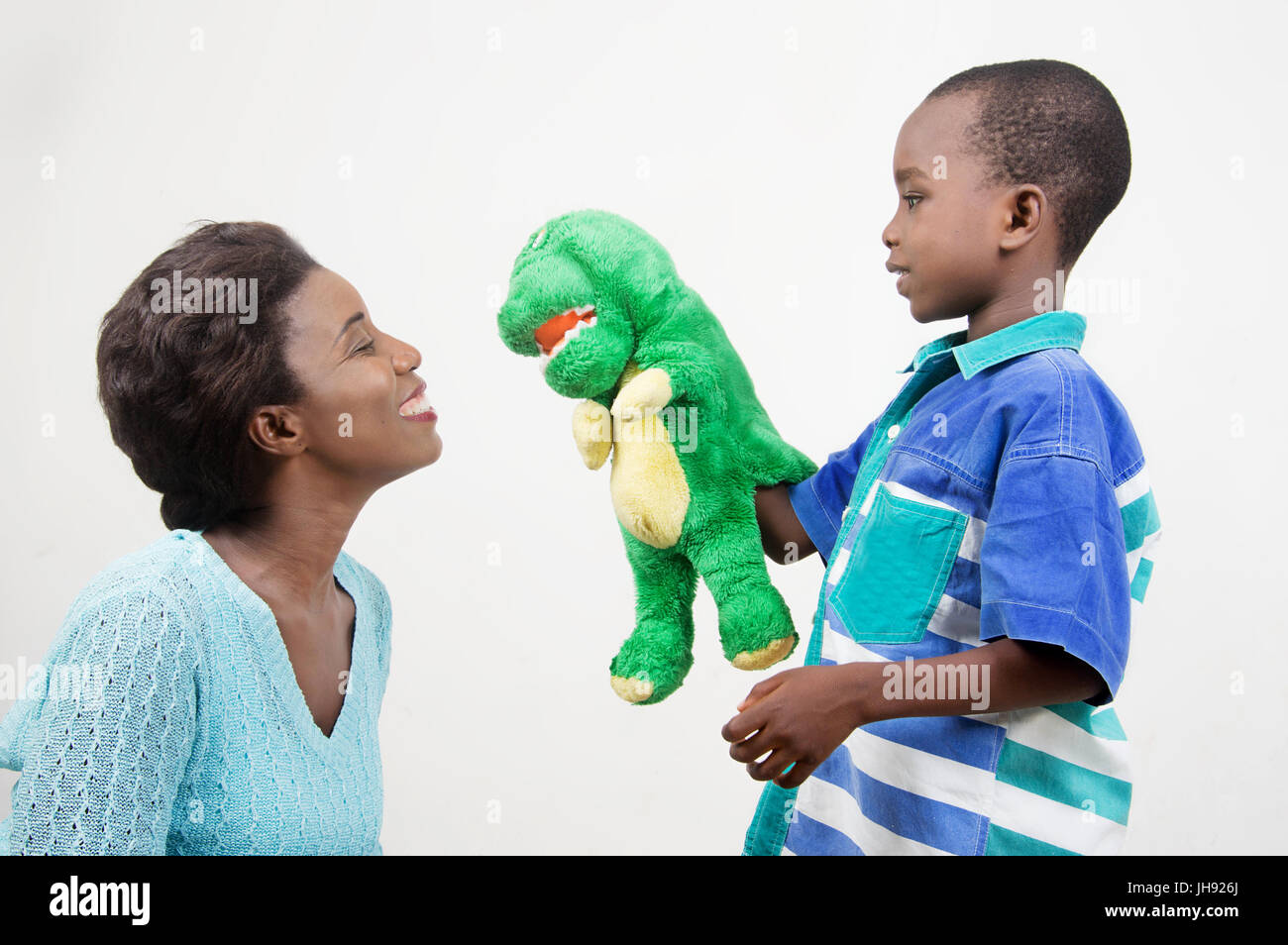 Child playing with his mother holding a toy in hand Stock Photo - Alamy