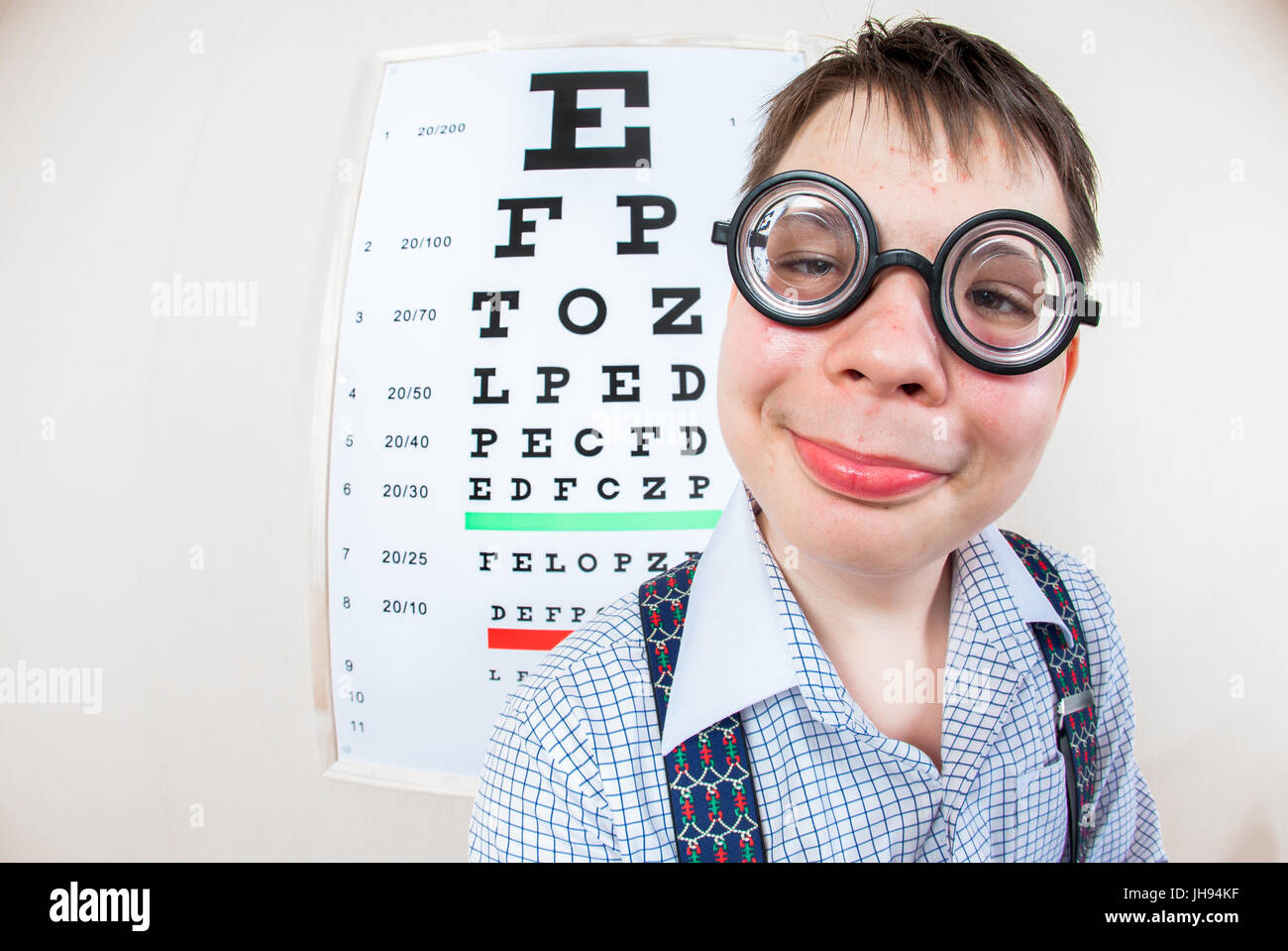 Person wearing spectacles in an office at the doctor Stock Photo - Alamy