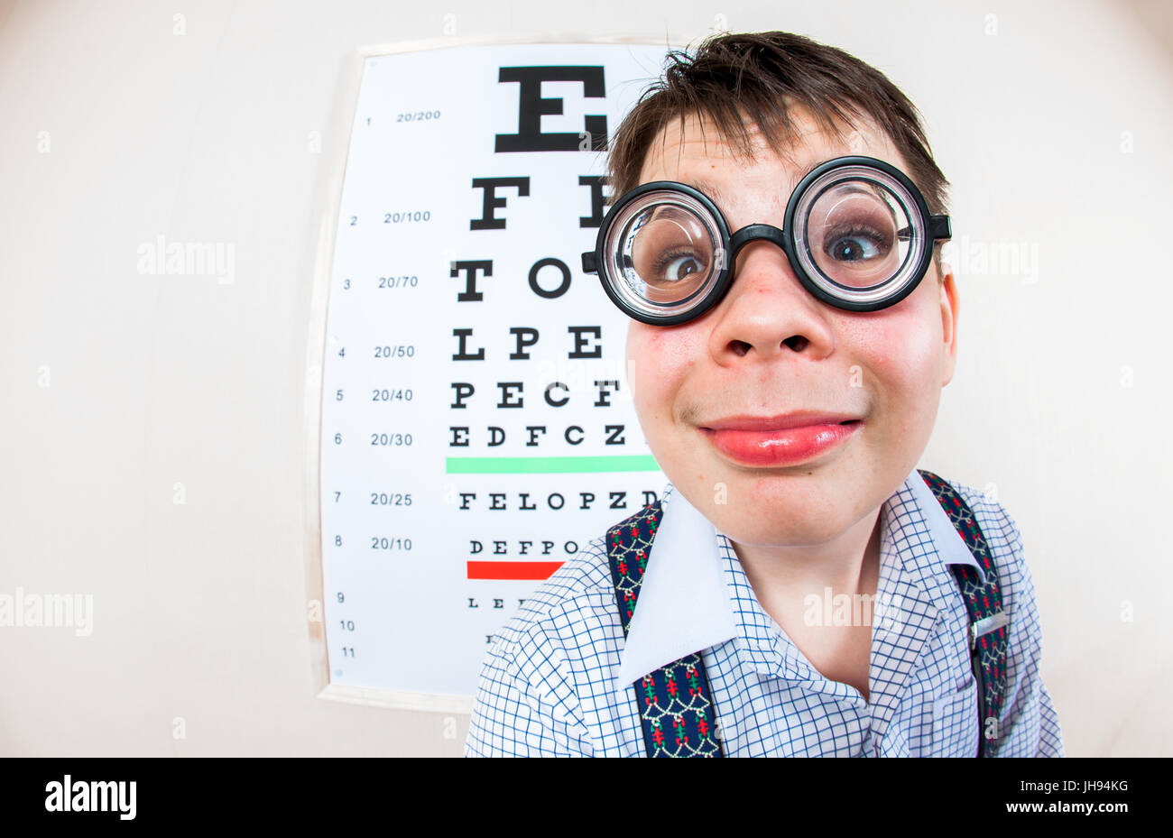 Person wearing spectacles in an office at the doctor Stock Photo - Alamy