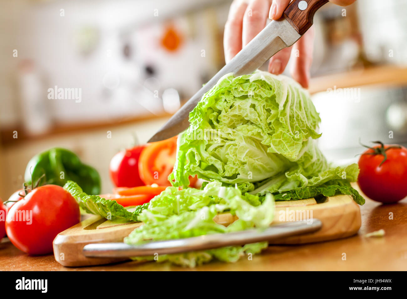 Womans hands cutting lettuce hi-res stock photography and images - Alamy