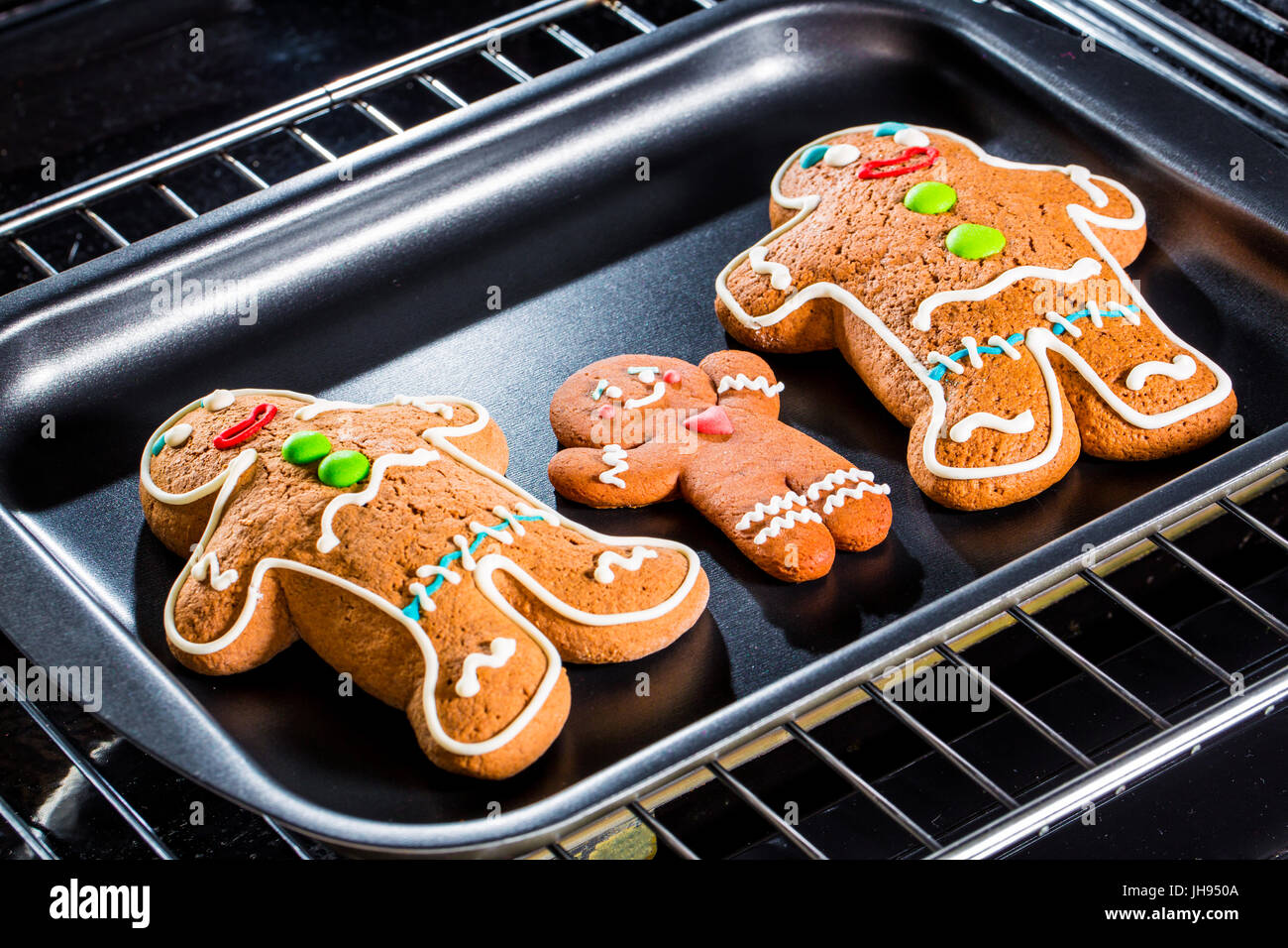 Baking Gingerbread man in the oven. Cooking in the oven Stock Photo - Alamy