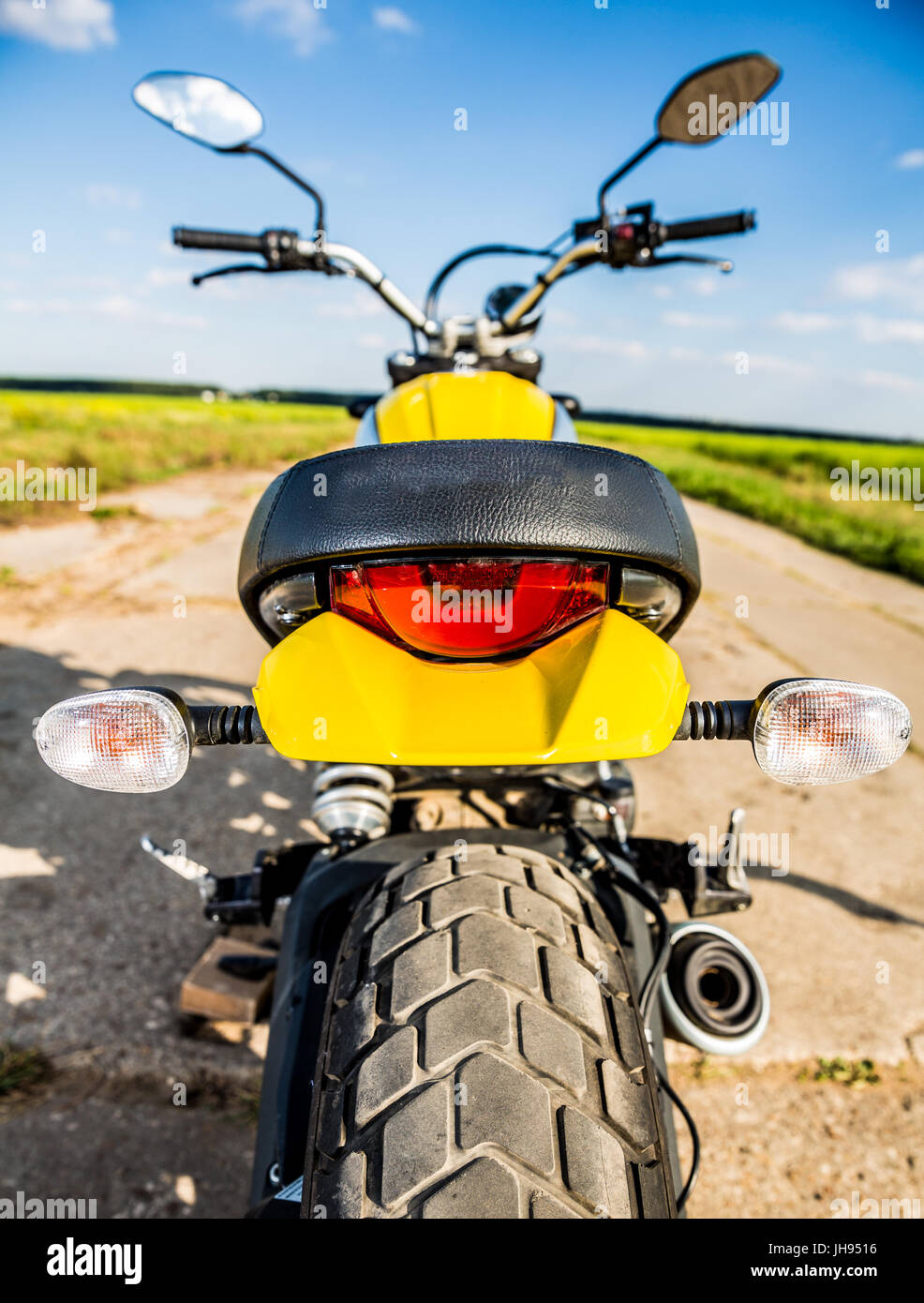 Motorcycle on the road back view Stock Photo - Alamy