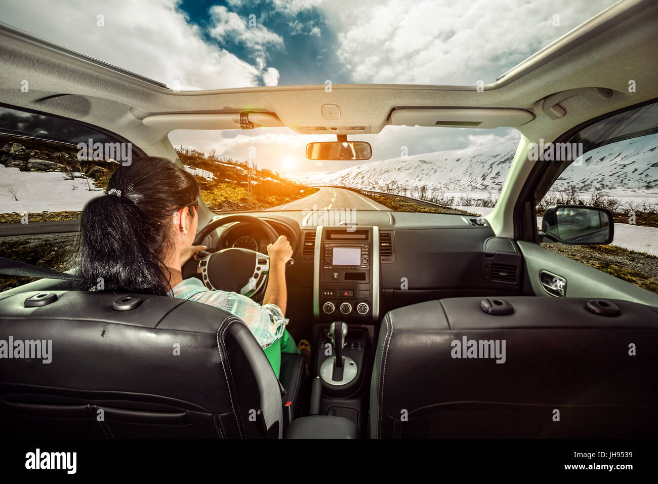 Woman rides on the car at high speed Stock Photo - Alamy