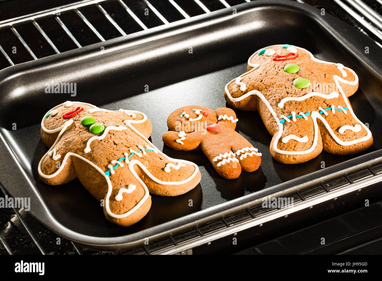 Baking Gingerbread man in the oven. Cooking in the oven Stock Photo - Alamy