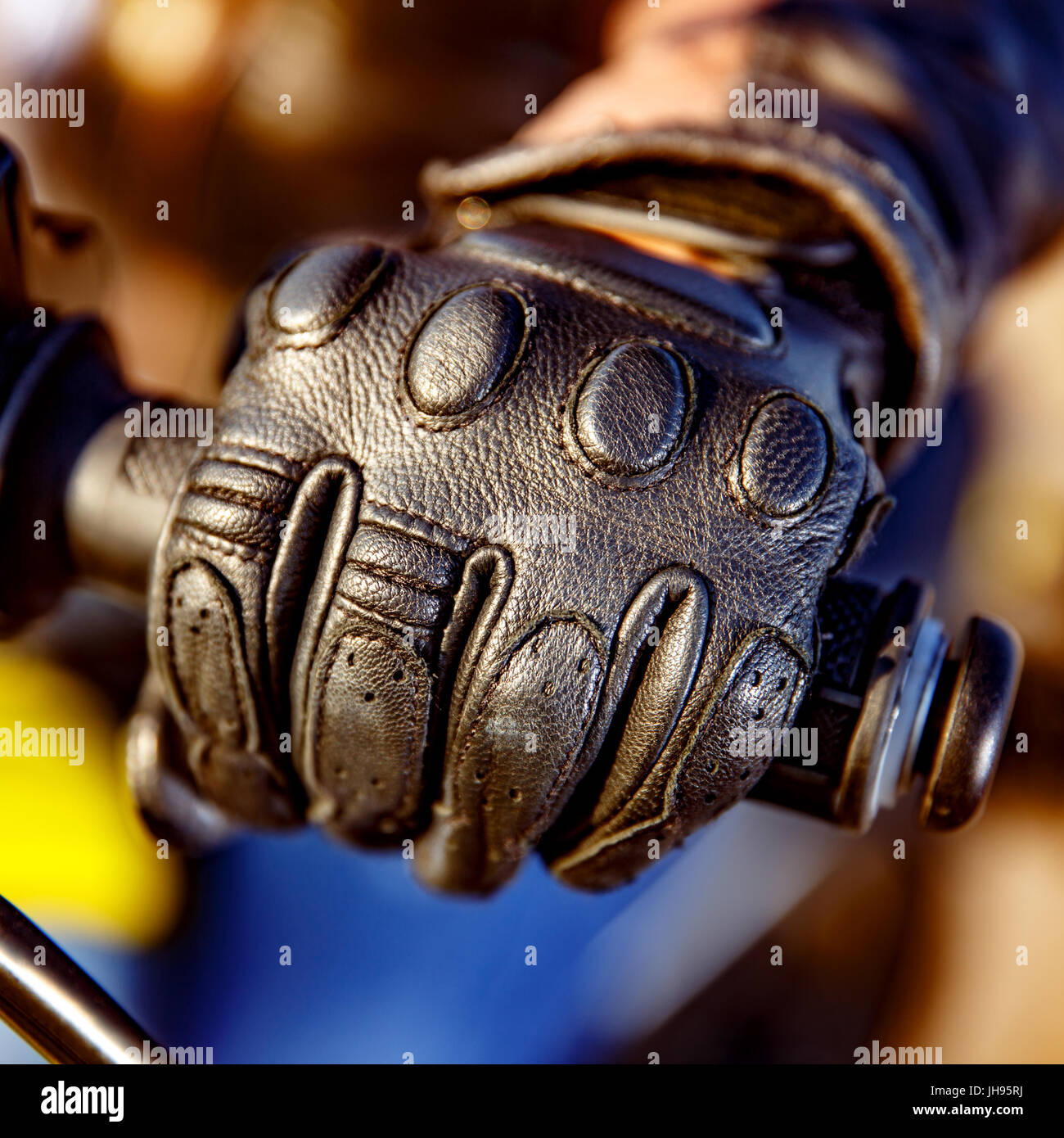 Human hand in a Motorcycle Racing Gloves holds a motorcycle throttle ...
