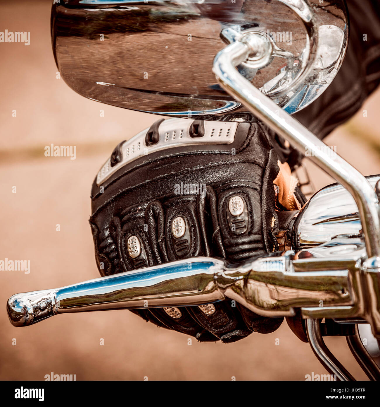 Human hand in a Motorcycle Racing Gloves holds a motorcycle throttle ...