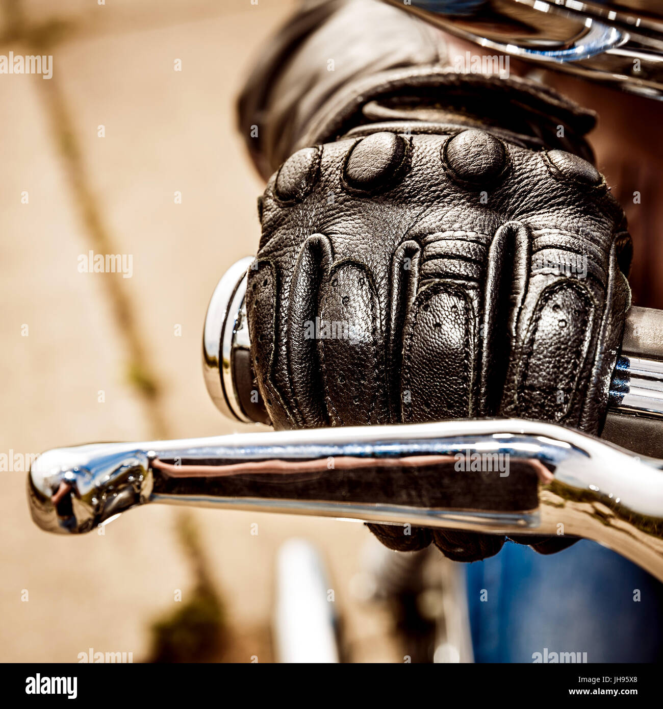 Human hand in a Motorcycle Racing Gloves holds a motorcycle throttle ...