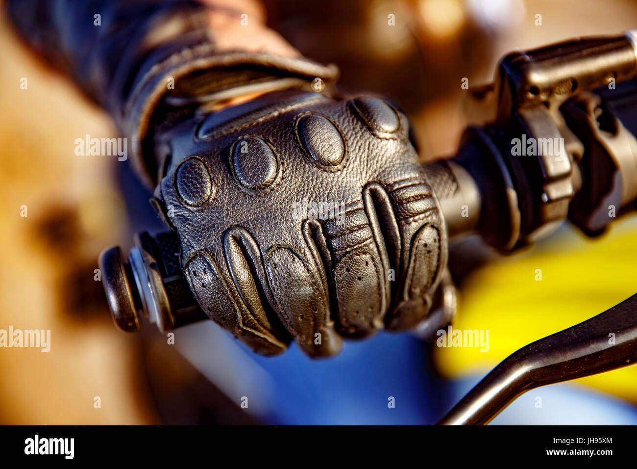 Human hand in a Motorcycle Racing Gloves holds a motorcycle throttle ...