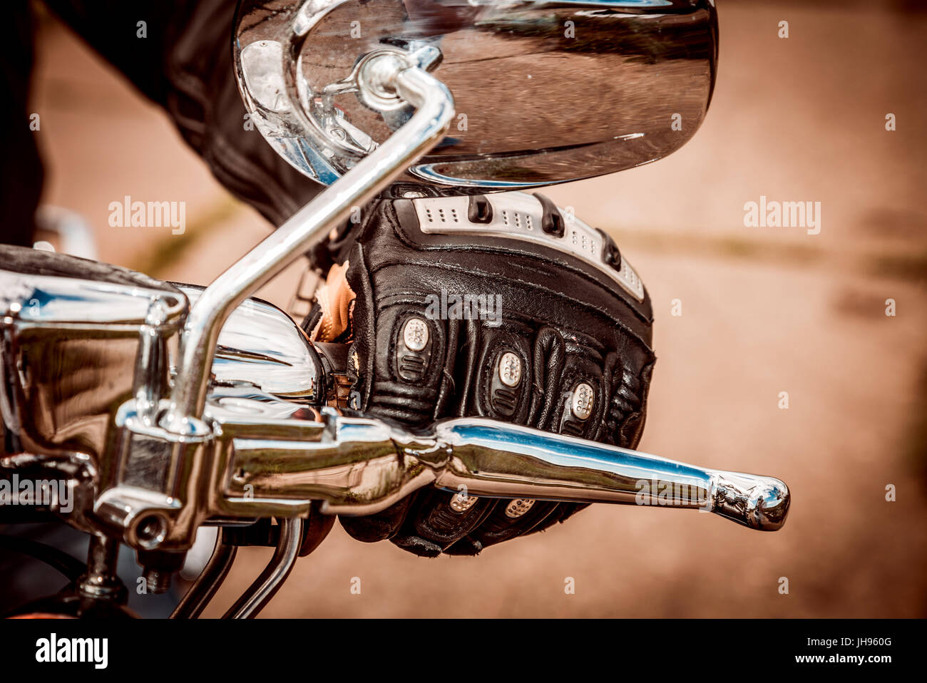 Human hand in a Motorcycle Racing Gloves holds a motorcycle throttle ...