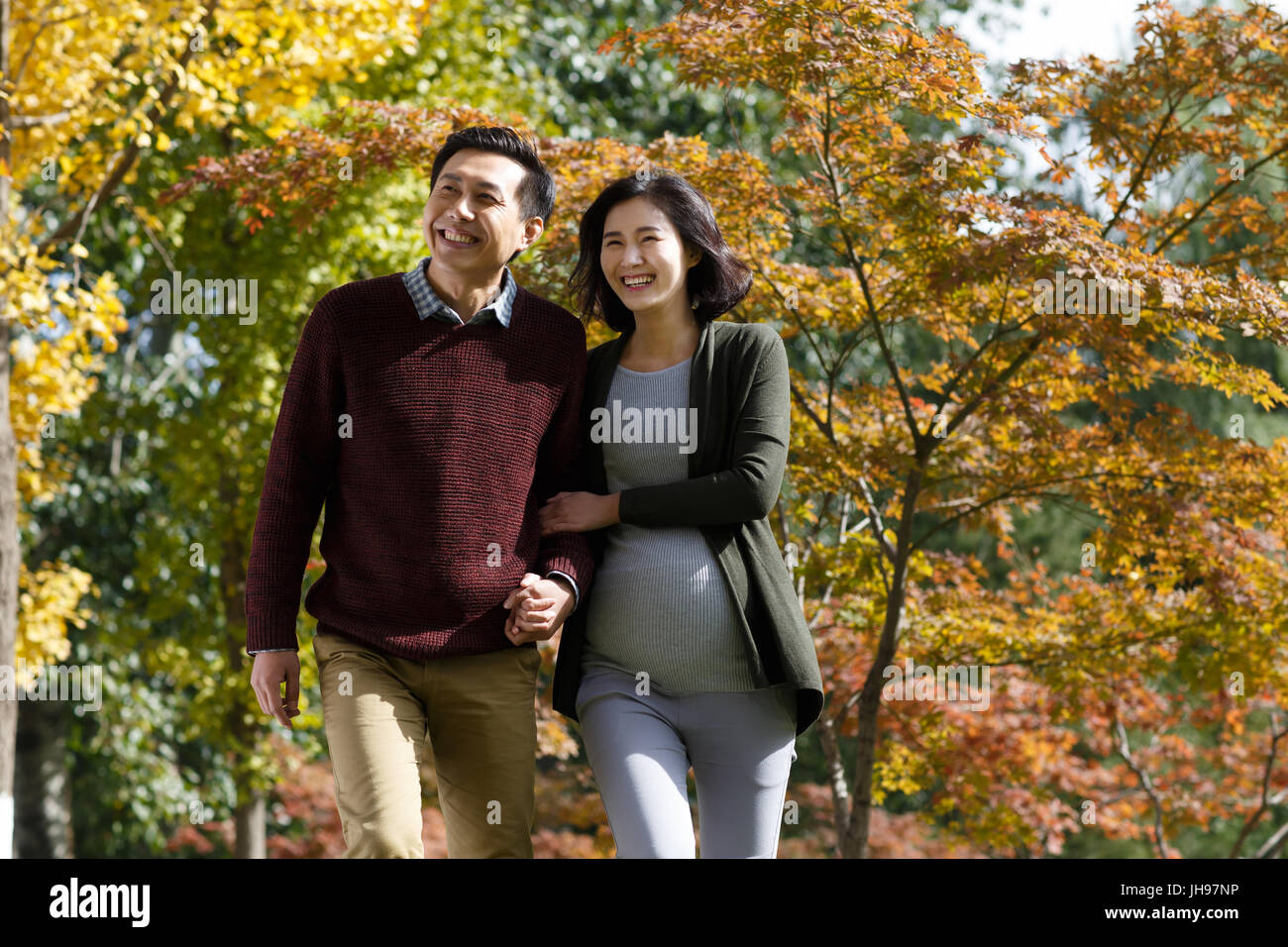 Young couple taking a walk outside Stock Photo - Alamy
