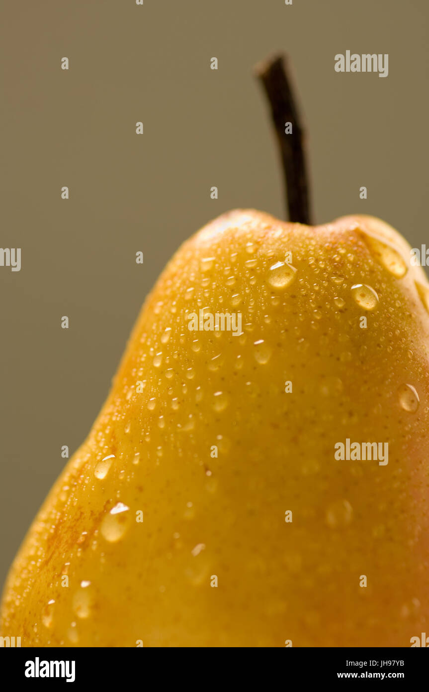 Yellow tasty pear. Drops of water. Studio shot Stock Photo - Alamy