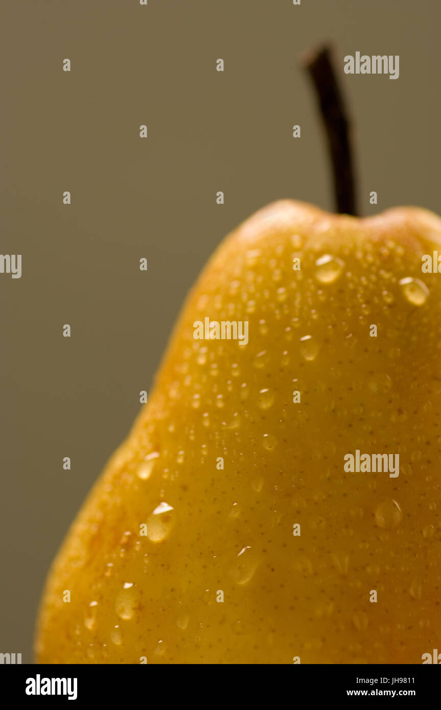 Yellow tasty pear. Drops of water. Studio shot Stock Photo - Alamy
