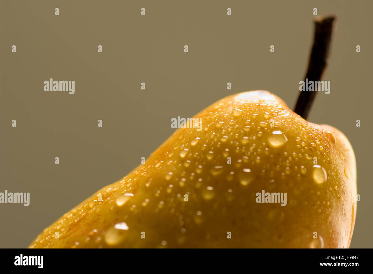 Yellow tasty pear. Drops of water. Studio shot Stock Photo - Alamy