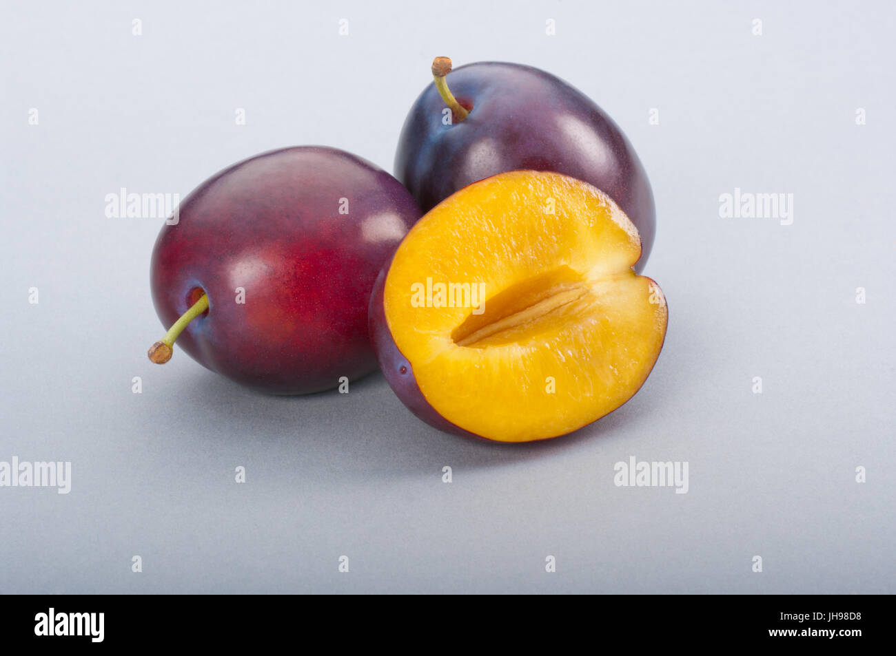 Fresh plums on white background. Studio shoot Stock Photo - Alamy