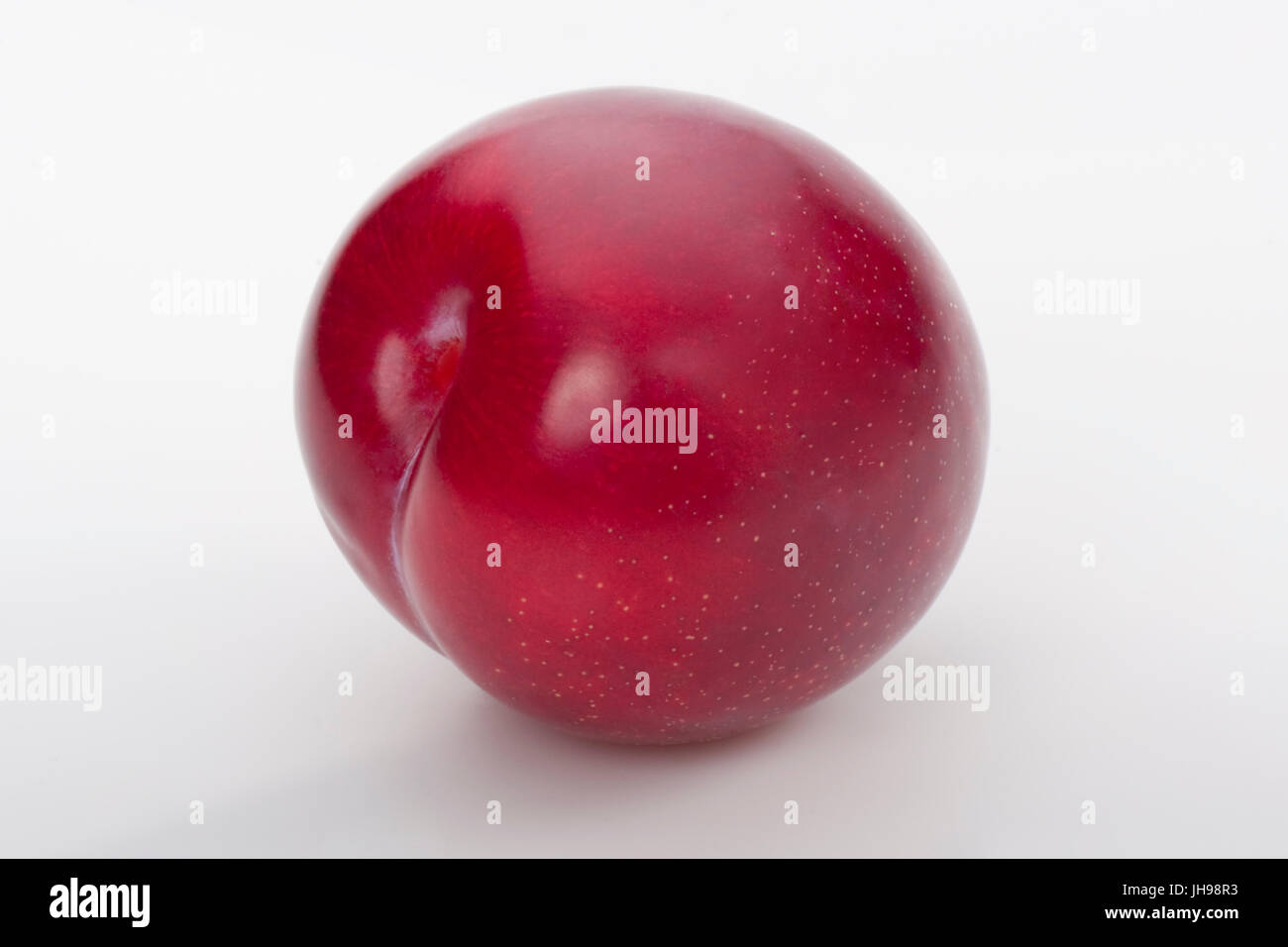 Red plum on white background. Studio shoot Stock Photo - Alamy