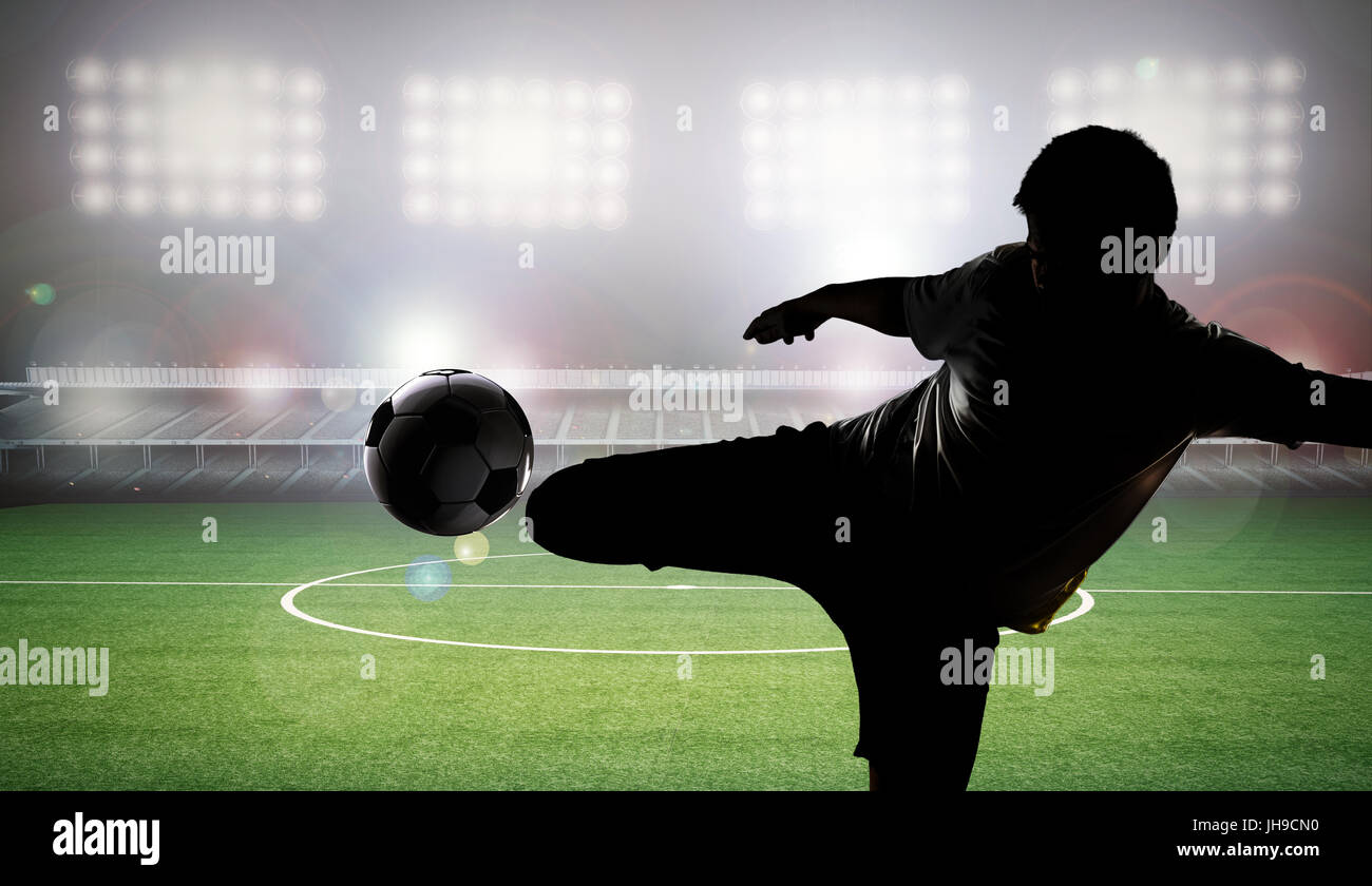 Football player kicking ball hi-res stock photography and images - Alamy