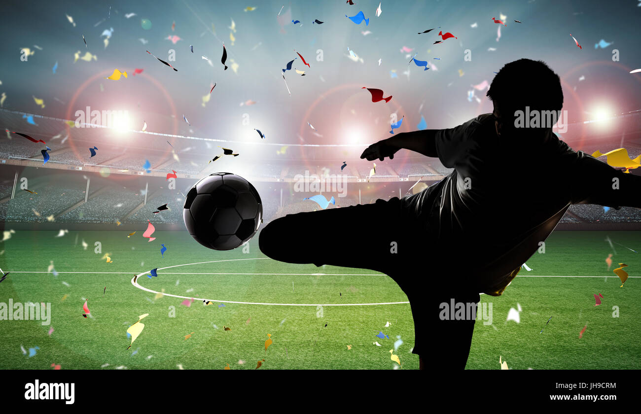 Footballer kicking ball hi-res stock photography and images - Alamy