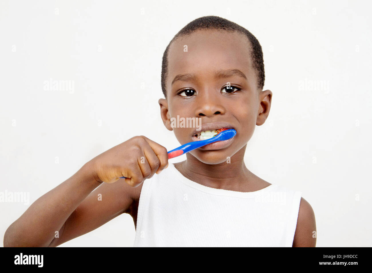 child holding toothbrush in hand brushes Stock Photo - Alamy