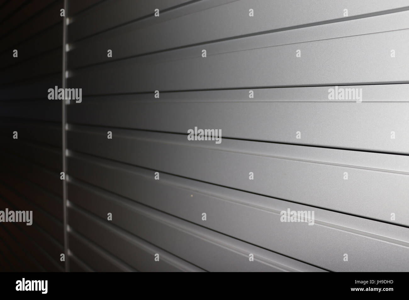 wall background,metalic wall blending light to dark Stock Photo - Alamy