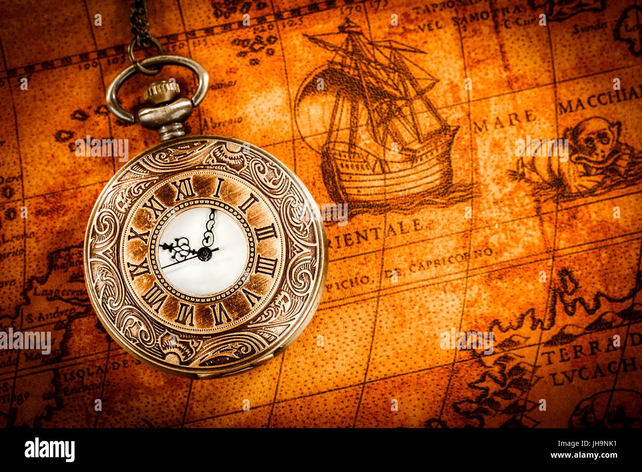 Vintage Antique pocket watch on an ancient world map in 1565 Stock ...