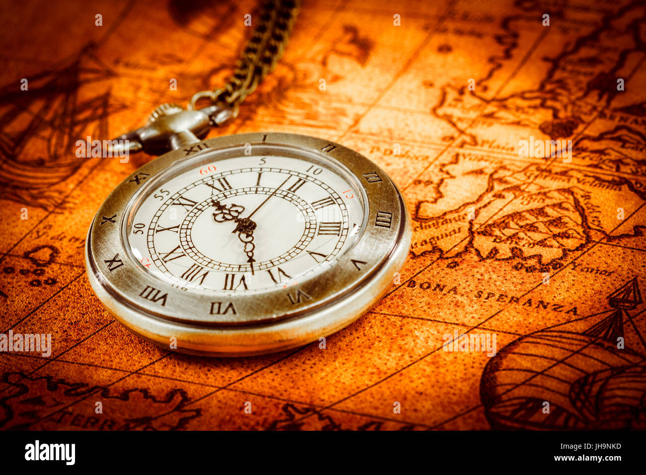 Vintage Antique pocket watch on an ancient world map in 1565 Stock ...