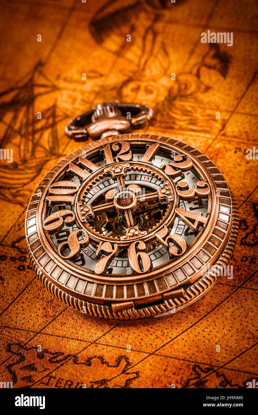 Vintage Antique pocket watch on an ancient world map in 1565 Stock ...