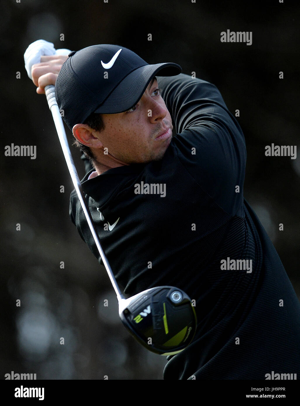 Rory McIlroy of Northern Ireland plays his tee shot at the 4th hole ...
