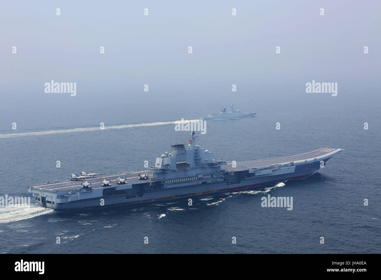 Aboard Liaoning Aircraft Carrier. 13th July, 2017. A flotilla including ...