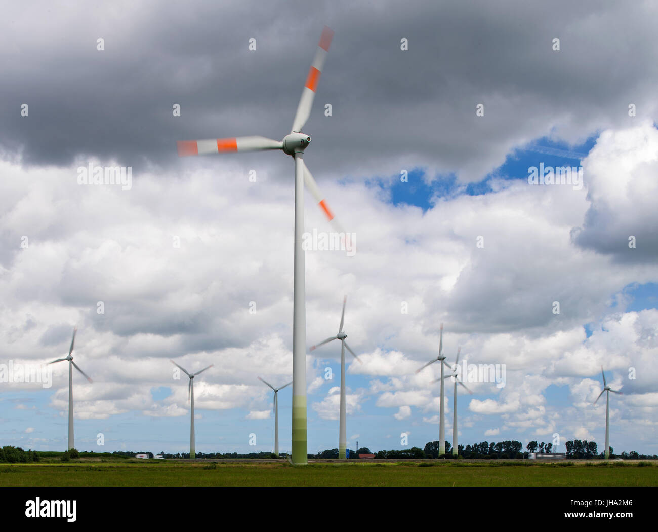Lower Saxony, Germany. 13th July, 2017. Turbines spinning under a white ...