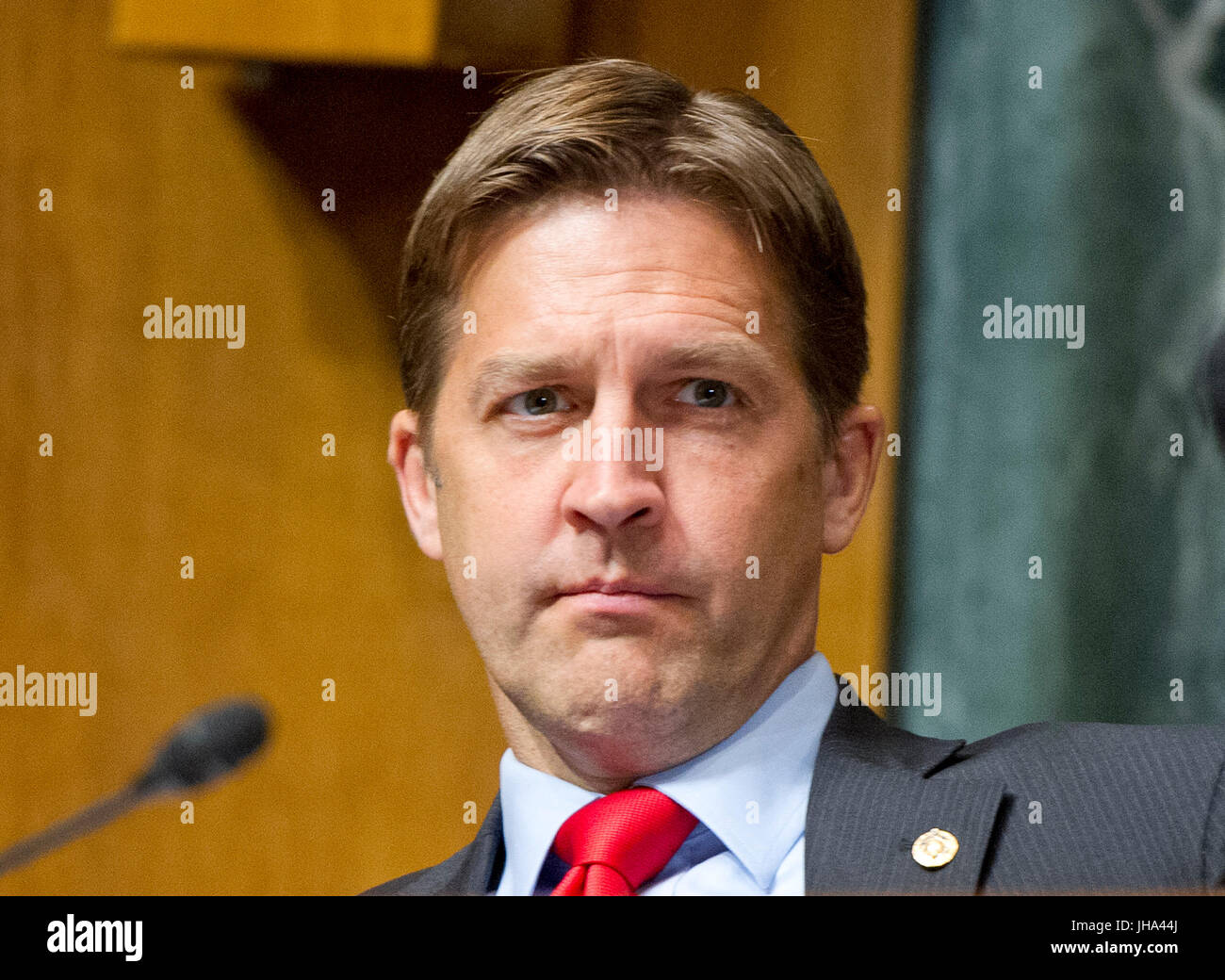 United States Senator Ben Sasse (Republican of Nebraska) listens as ...