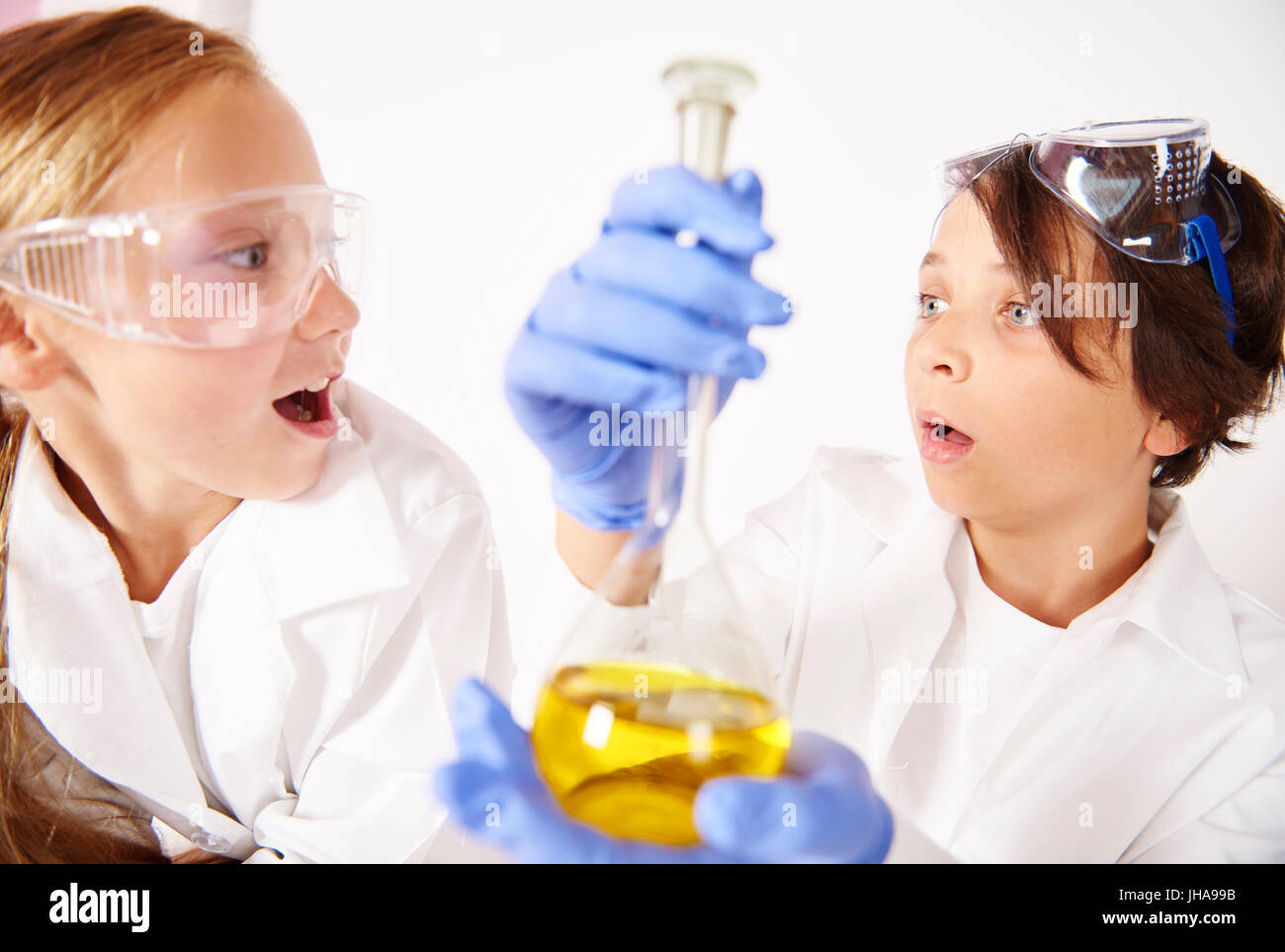 Kids are surprised to effect of experiment Stock Photo - Alamy