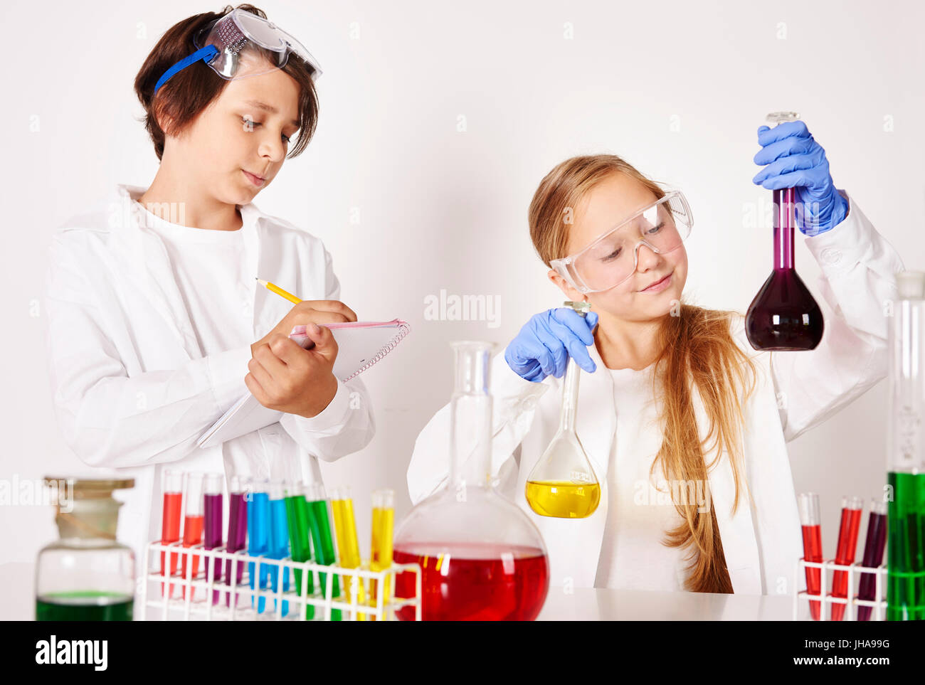 Little scientists working in laboratory Stock Photo - Alamy