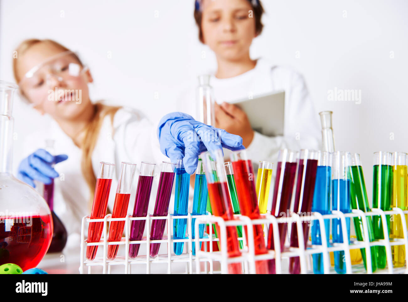 Making experiment together in laboratory Stock Photo - Alamy